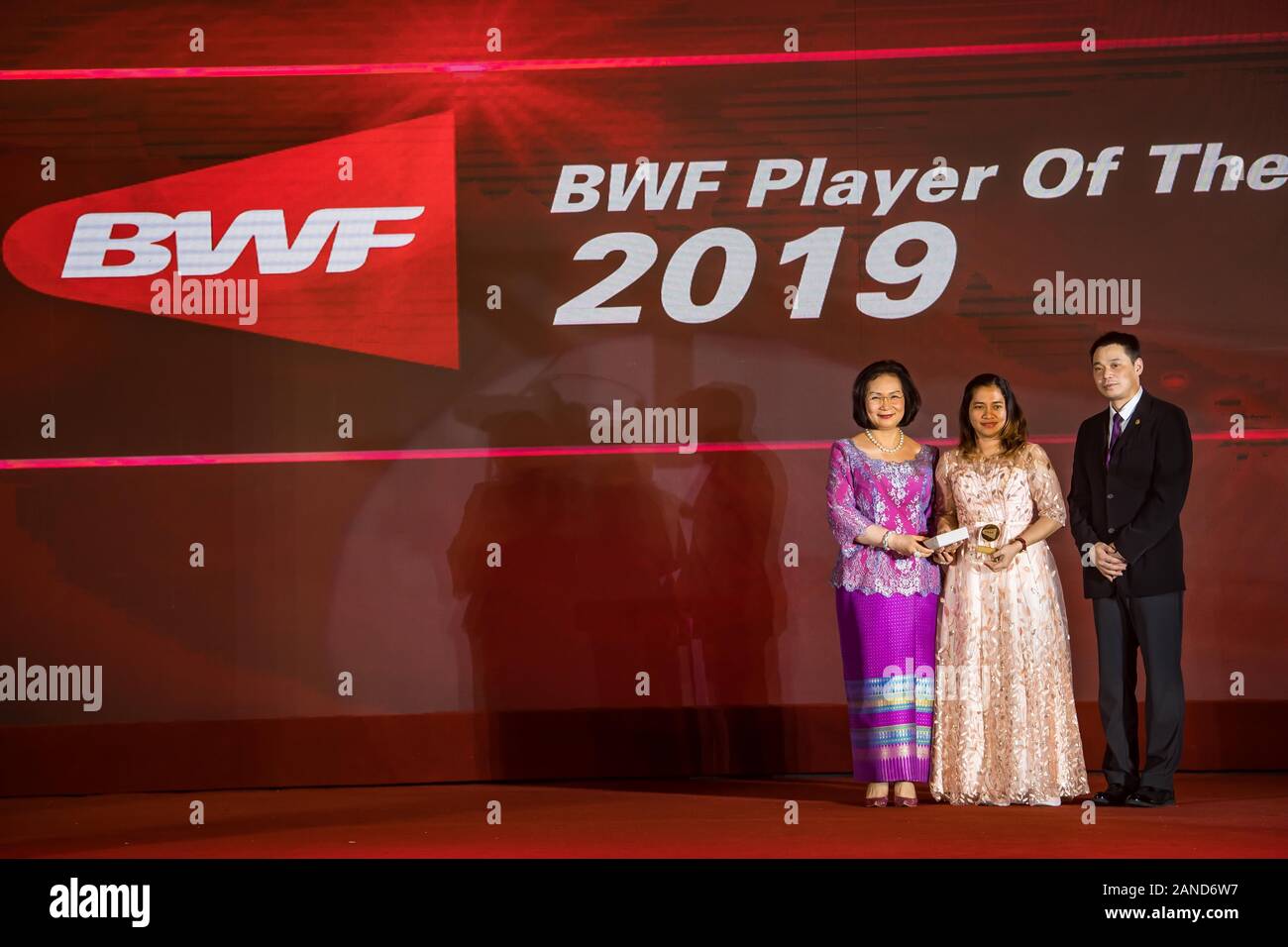 Indonesian badminton player Leani Ratri Oktila, middle, is honored with ...
