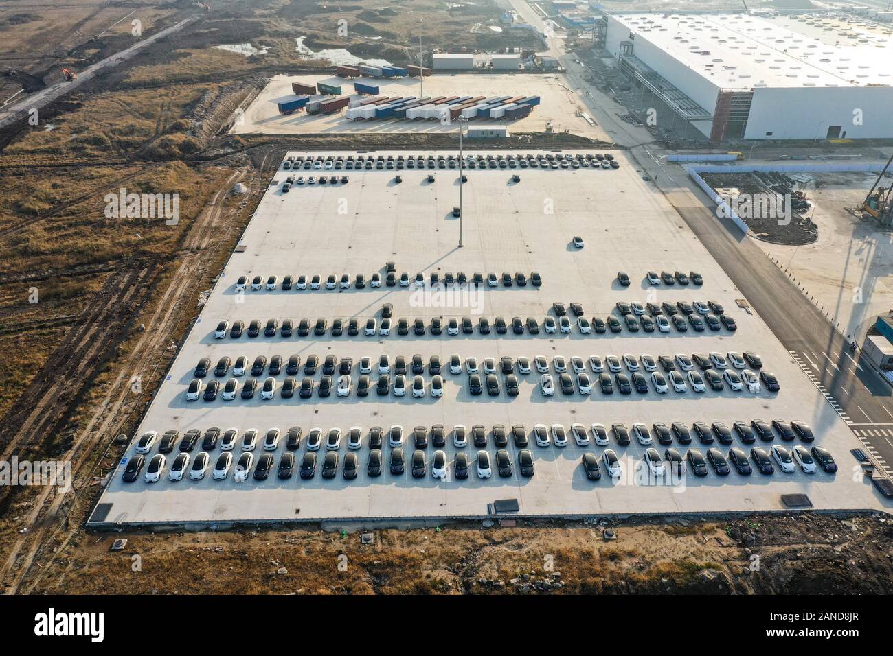 An aerial view of over 200 Tesla Model 3 arrayed in Tesla Gigafactory 3 ...