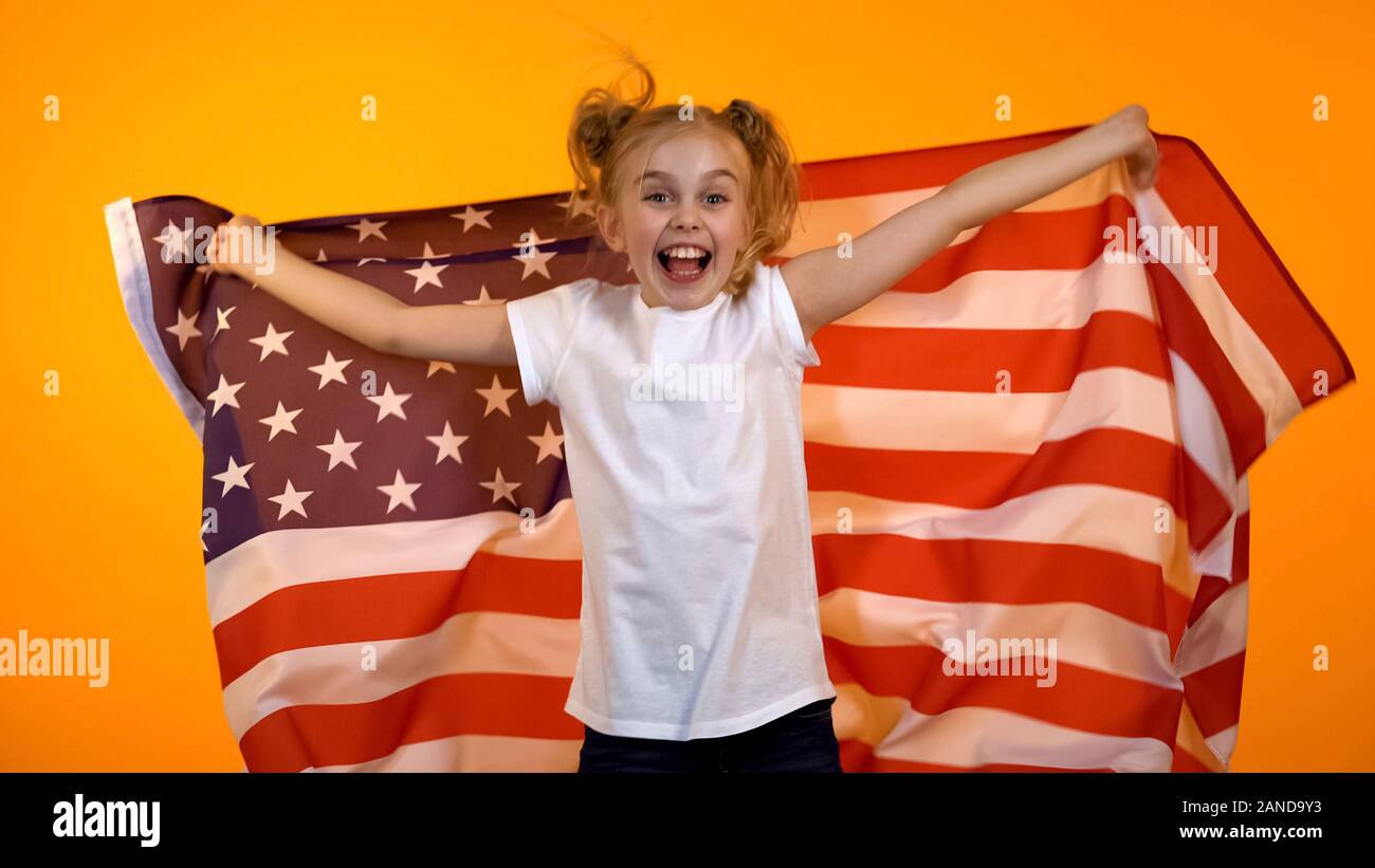 Girl jumping with flag hi-res stock photography and images - Alamy