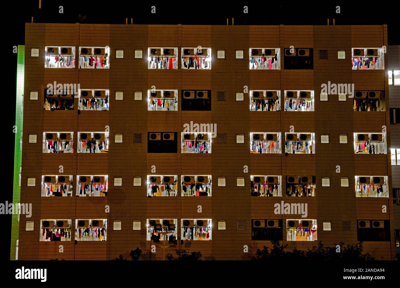 --FILE--An outside view of the dorm where migrant workers live and ...