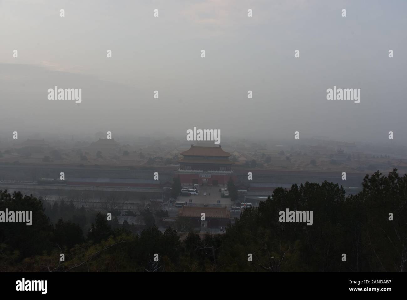 An aerial view of local landmarks seen faintly in the haze in Beijing ...