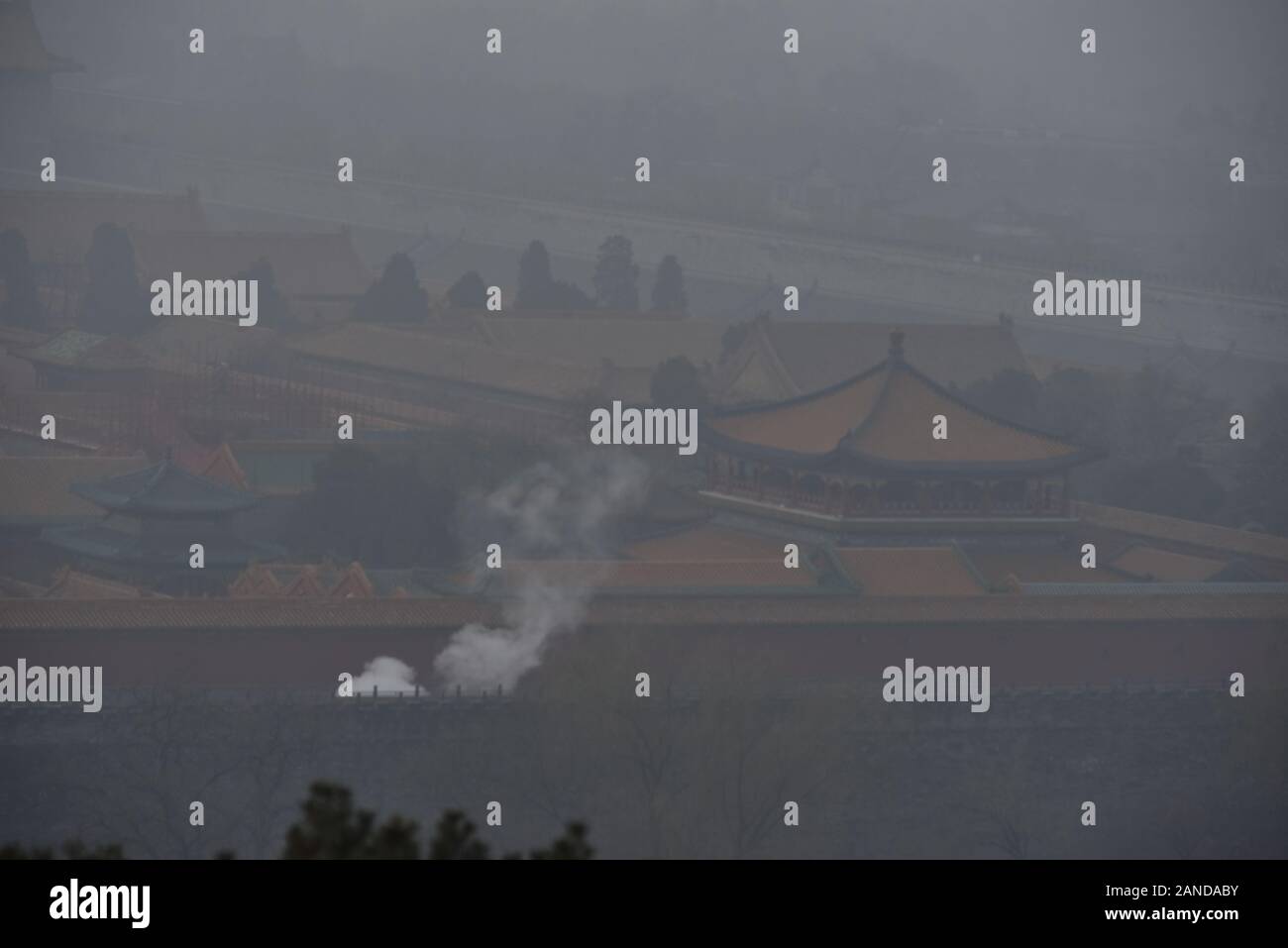 An aerial view of local landmarks seen faintly in the haze in Beijing ...