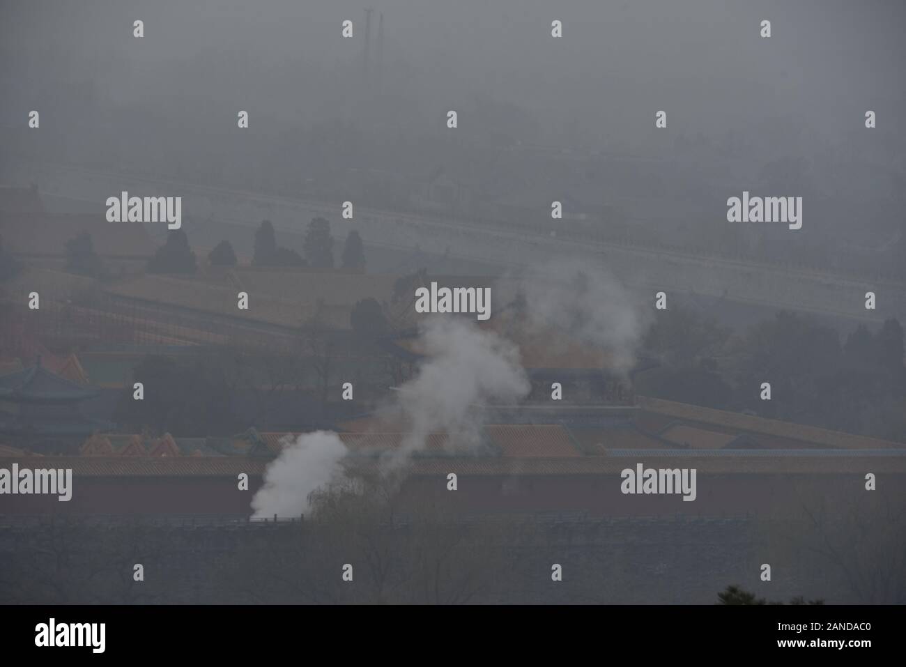 An aerial view of local landmarks seen faintly in the haze in Beijing ...