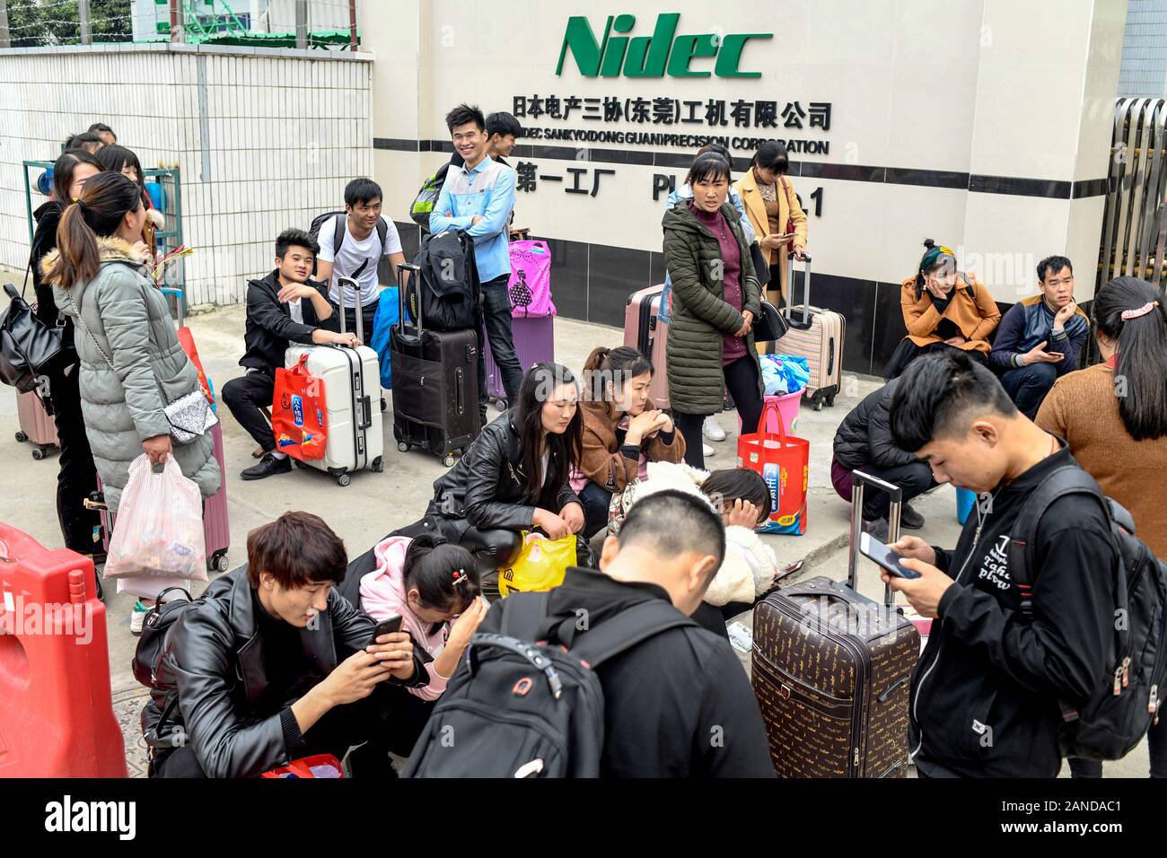 Chinese workers gather in front hi-res stock photography and images - Alamy