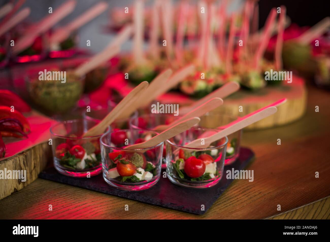 Buffet at party. quick snacks on the buffet table. Dishes with chopped ...