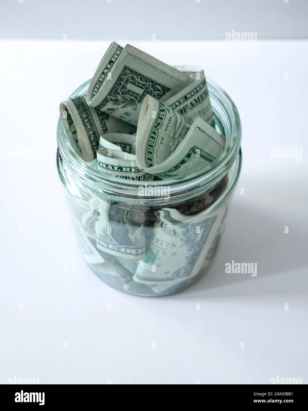 Dollar savings money jar banknote hi-res stock photography and images ...