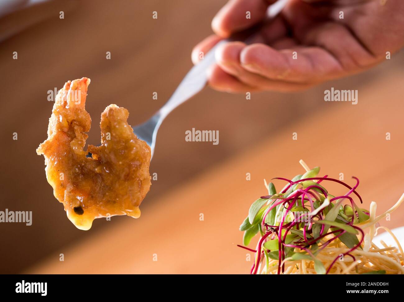 shrimp on a fork on a white background. nice Stock Photo - Alamy