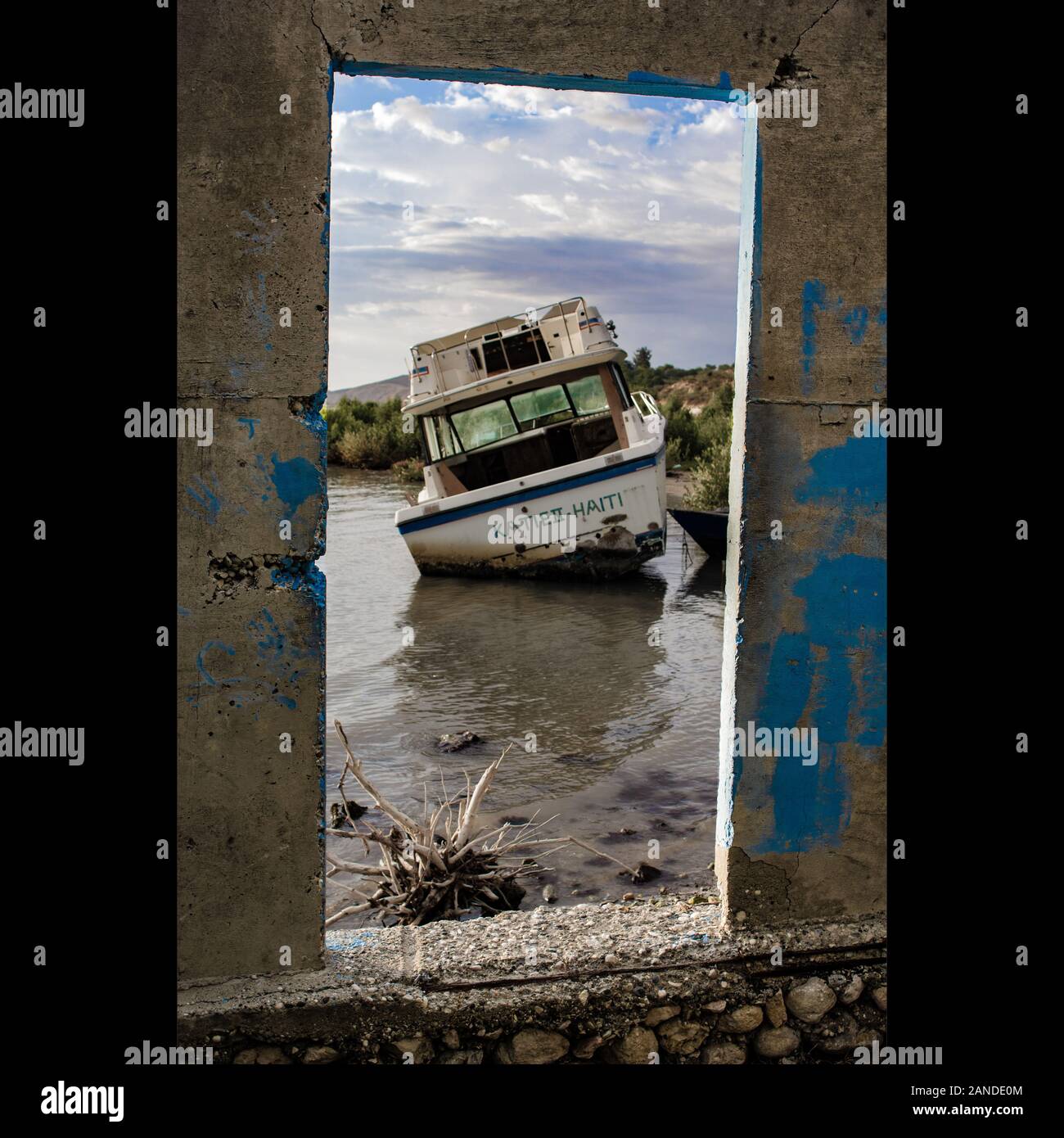 Boat on shore through door Stock Photo - Alamy