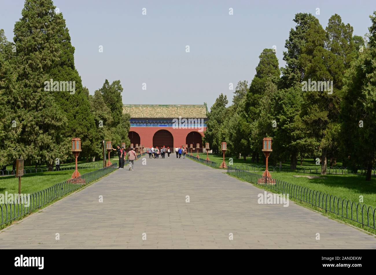 A path lined with trees and grass leads to a gateway in the Temple of ...