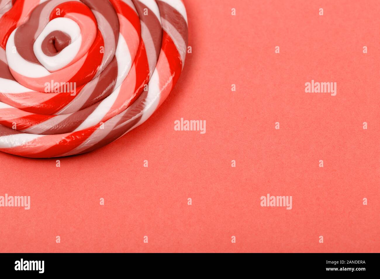 Big lollipop on solid pink background. Horizontal. Living coral theme ...
