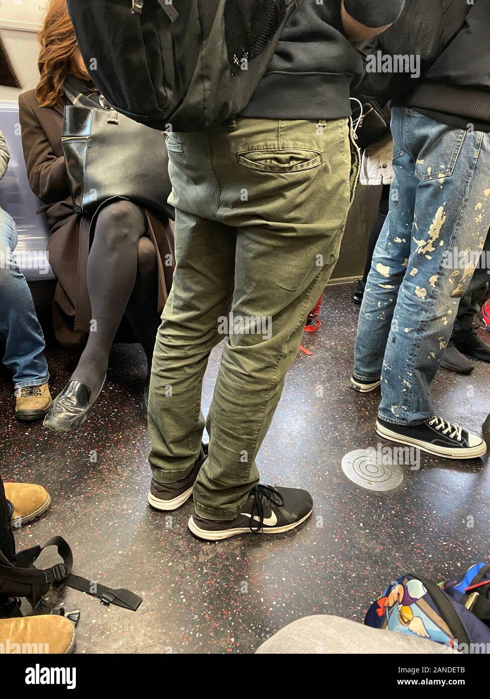 People riding a New York City subway train Stock Photo - Alamy