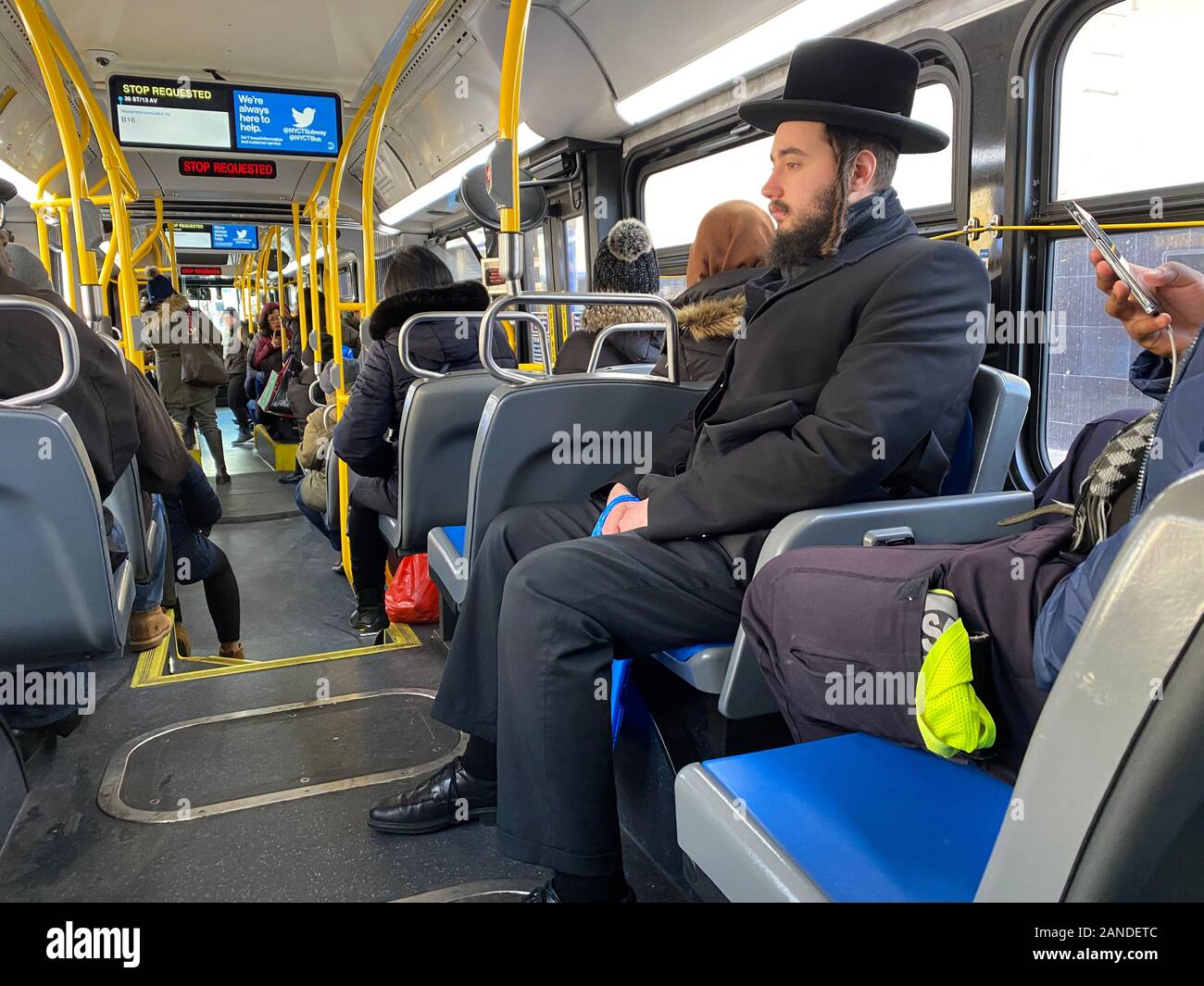 Orthodox Jewish man rides a local bus in the Borough Park neighborhood ...