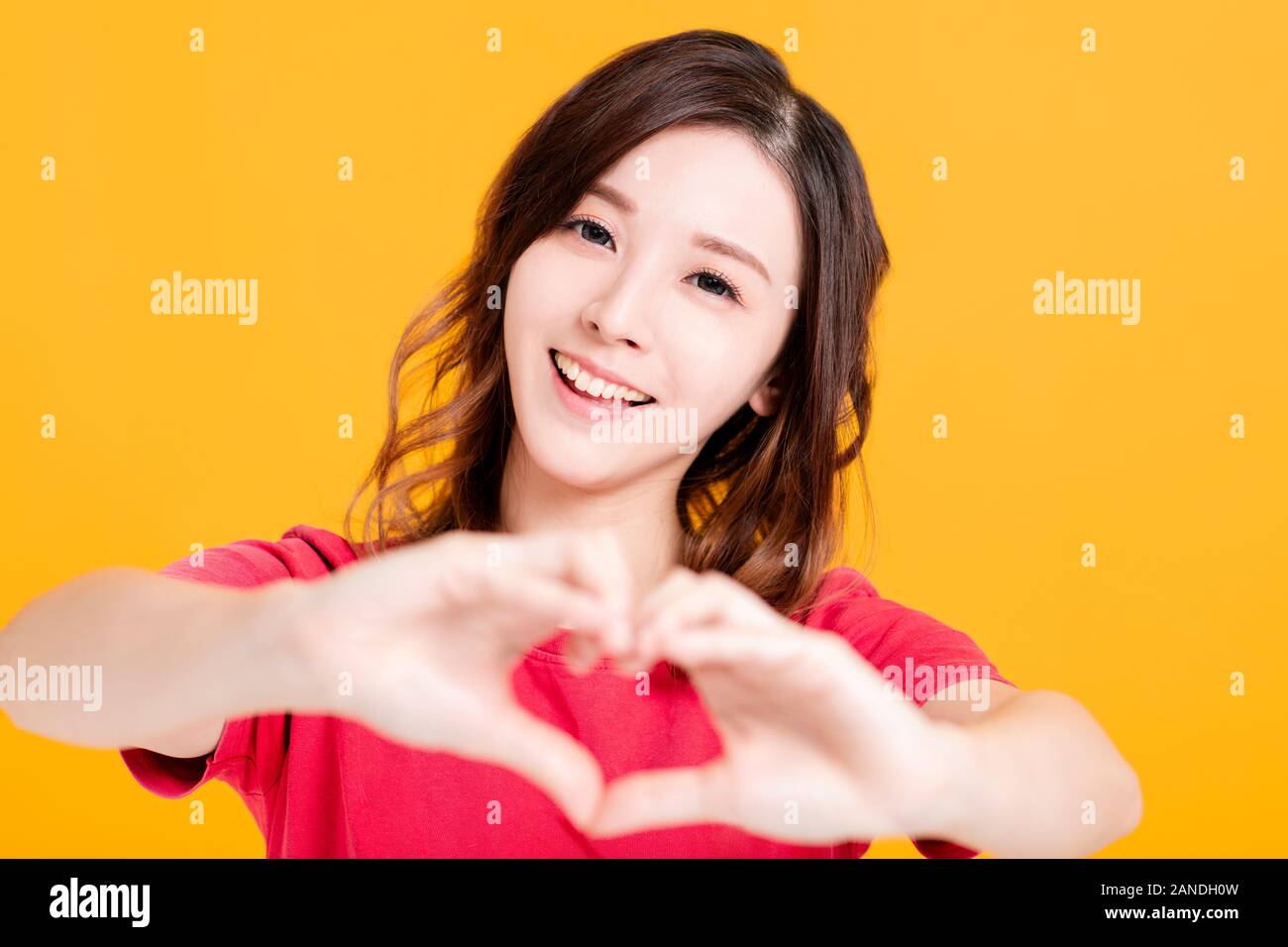 Closeup of Smiling Woman with love Gesture Stock Photo - Alamy