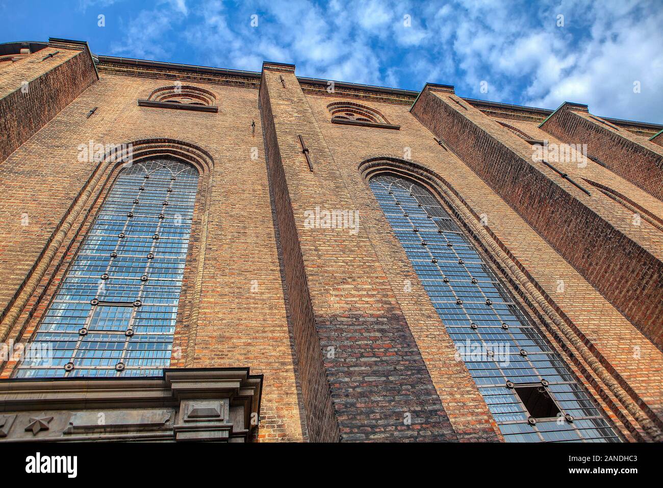 Church with big windows and red bricks wall Stock Photo - Alamy