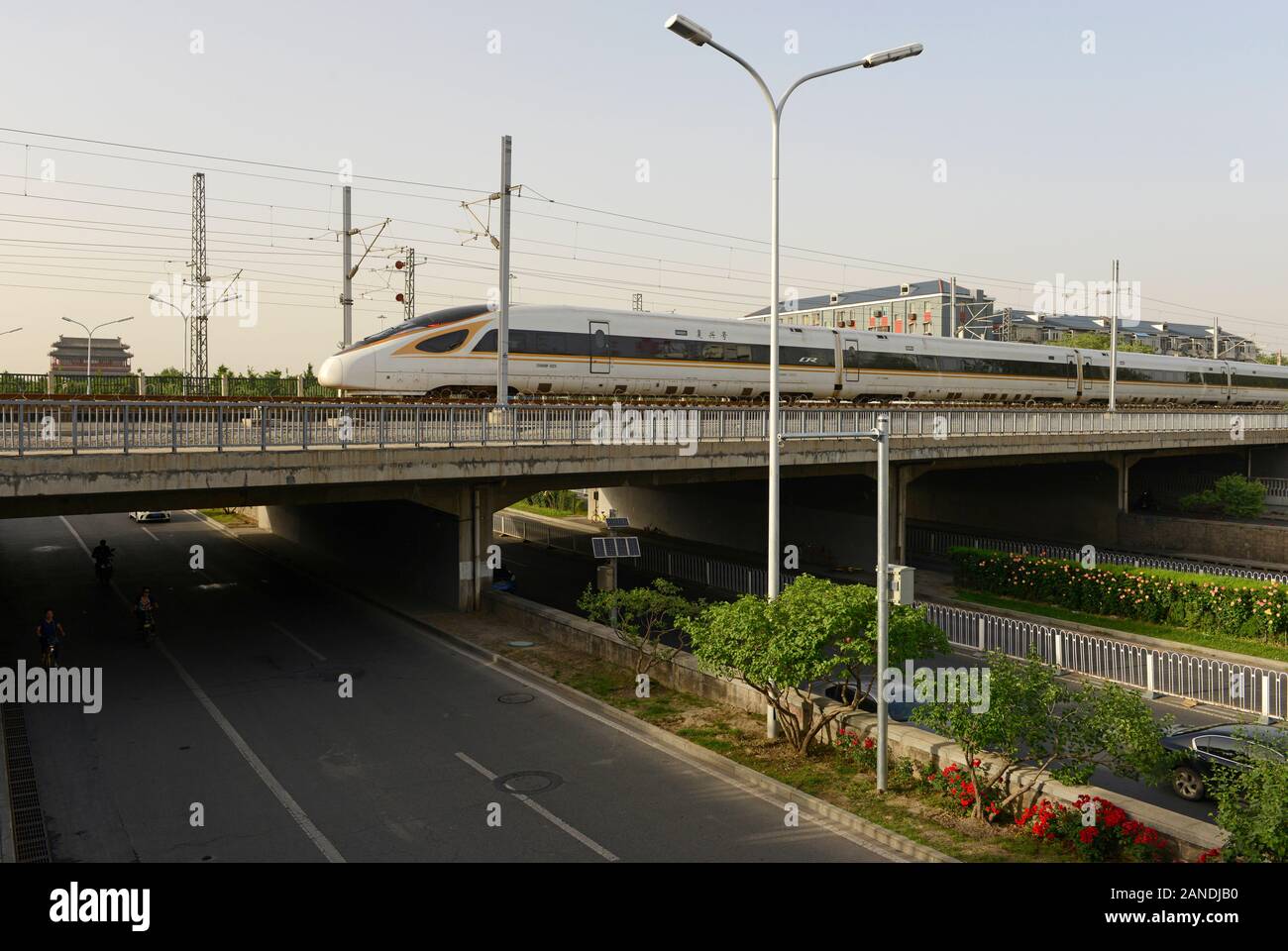 A high speed train passes over a bridge in Yongdingmen in southern ...