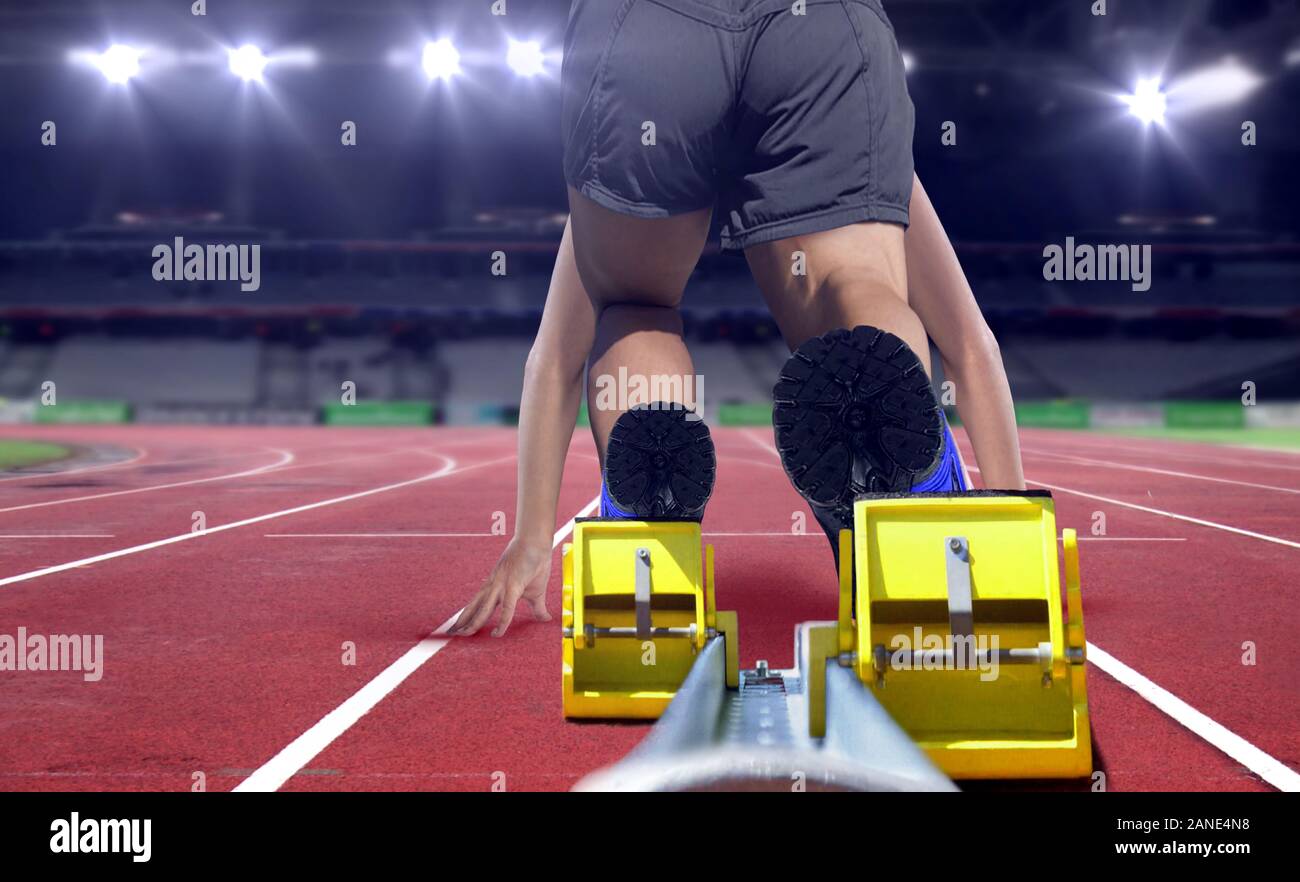 sprinter athlete launching off from the start line in a race Stock ...