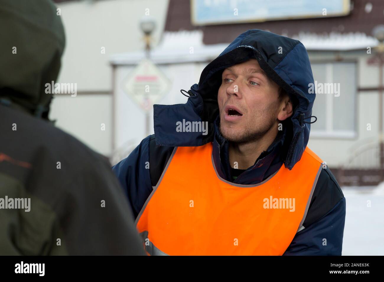 Two workers at the assembly site of the ice town Stock Photo - Alamy