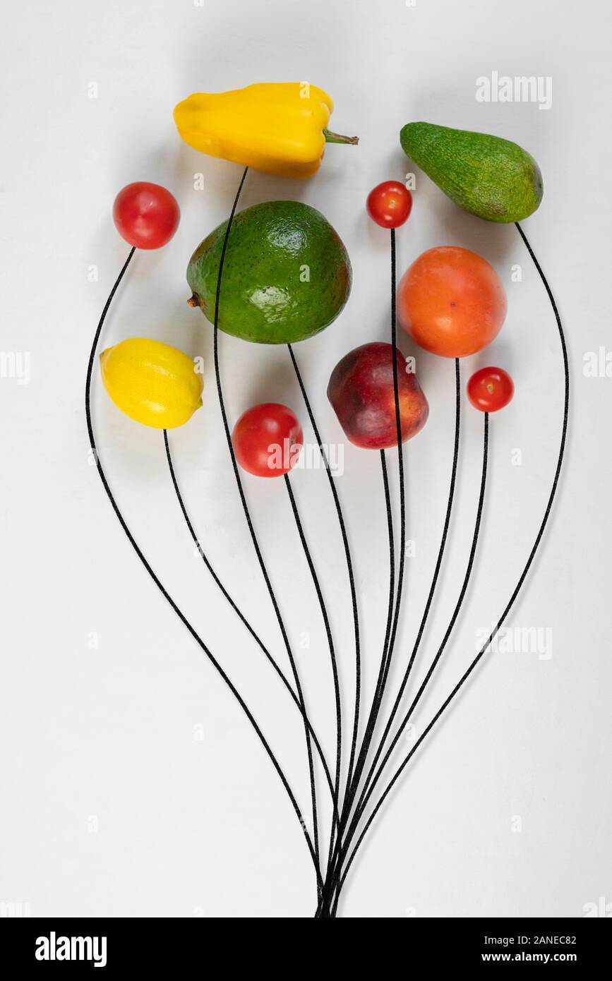 a creative concept of mix of bunch of fruit fly in the air like balloon ...