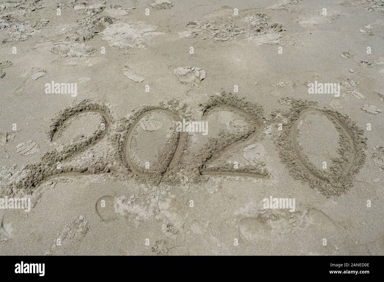 Handwritten 2020 Numbers Inscription On beach; happy new year 2020 ...