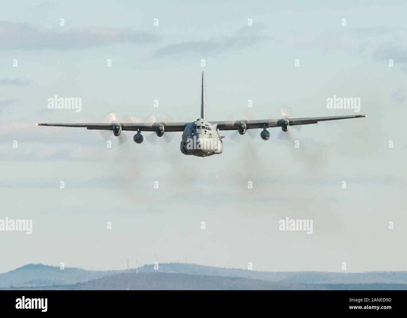 A C-130H Hercules assigned to the 103rd Airlift Wing flies over western ...