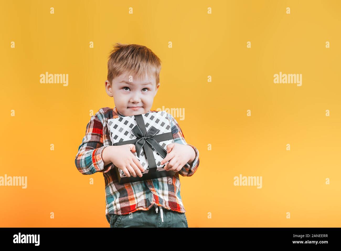 boy holding present Stock Photo - Alamy