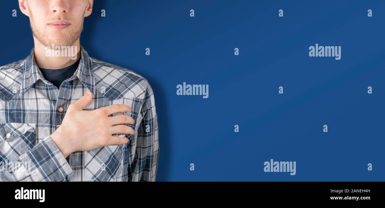 male person holding his hand to the chest heart, the concept of trust ...