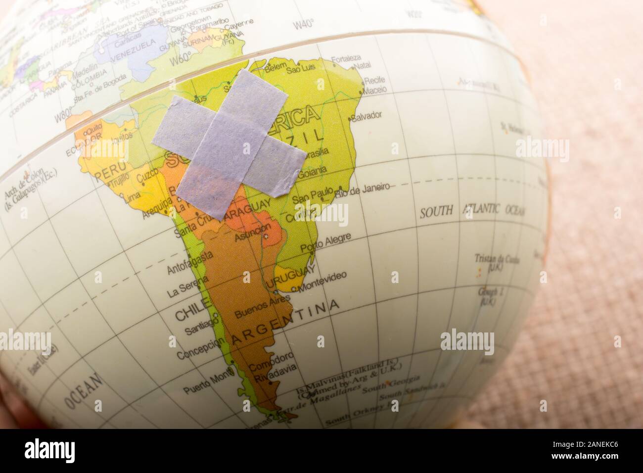 Adhesive plaster on an Earth globe in the view Stock Photo - Alamy