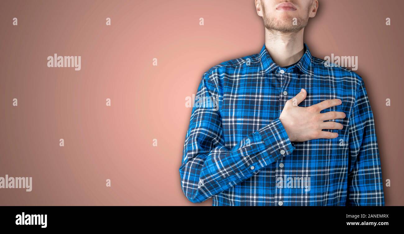 male person holding his hand to the chest heart, the concept of trust ...