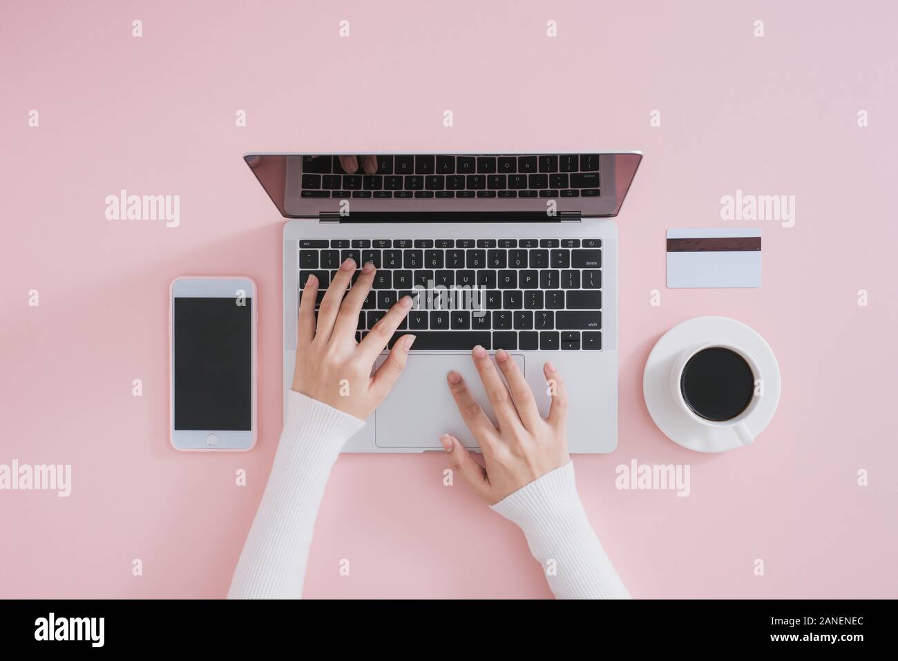 Human using laptop top view on minimal workspace. Color background and ...