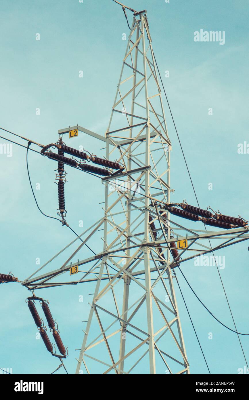 High voltage electric pole with wires on blue sky background. Line of ...