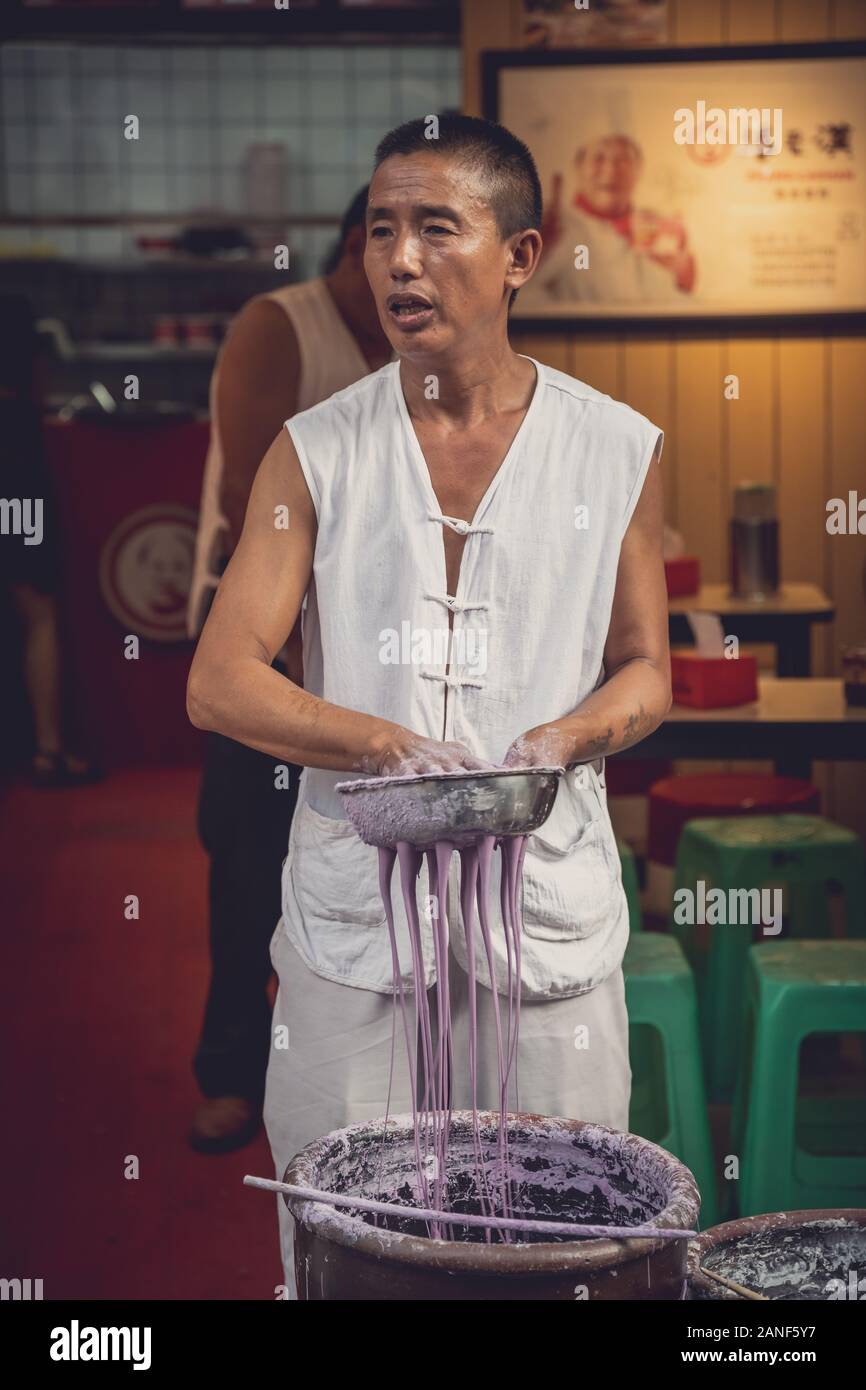 Chongqing, China - August 2019 :Male chef preparing and making ...