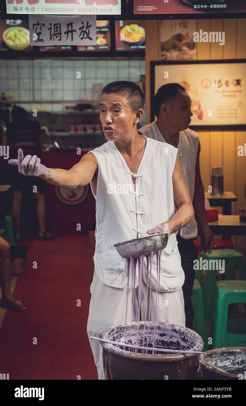 Chongqing, China - August 2019 :Male chef preparing and making ...