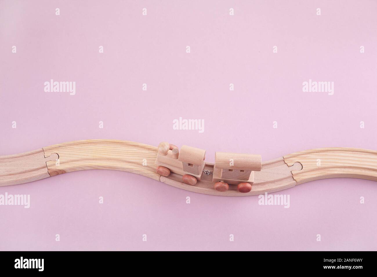 Zero waste. Eco wooden toys on pink background. Top view Stock Photo ...