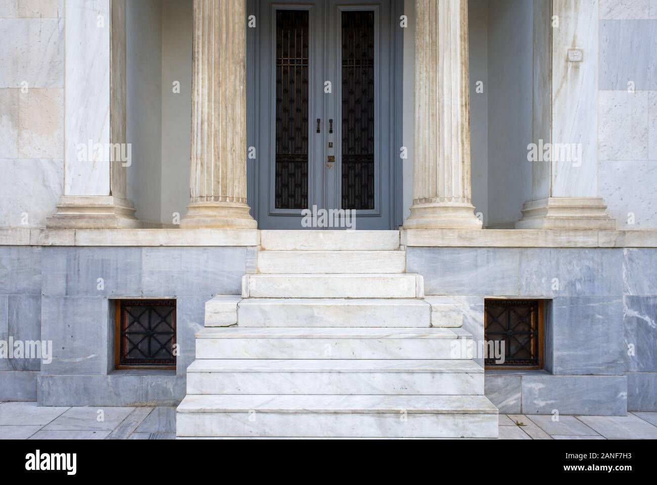 Impressive entrance with marble columns, classical architecture ...