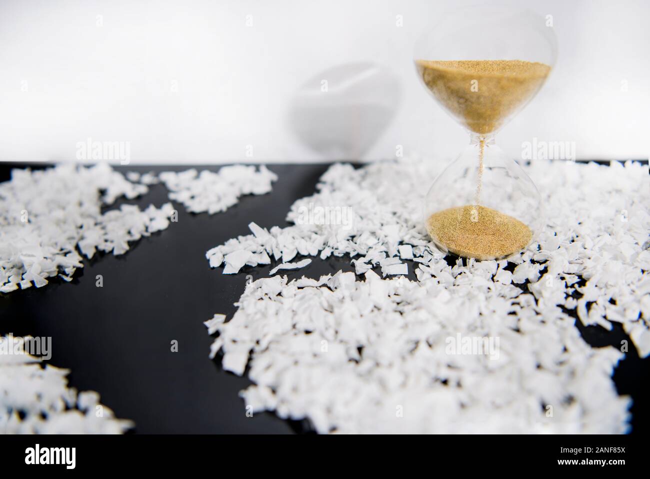 Abstract photo with toilet paper and some small people figures. Waste ...