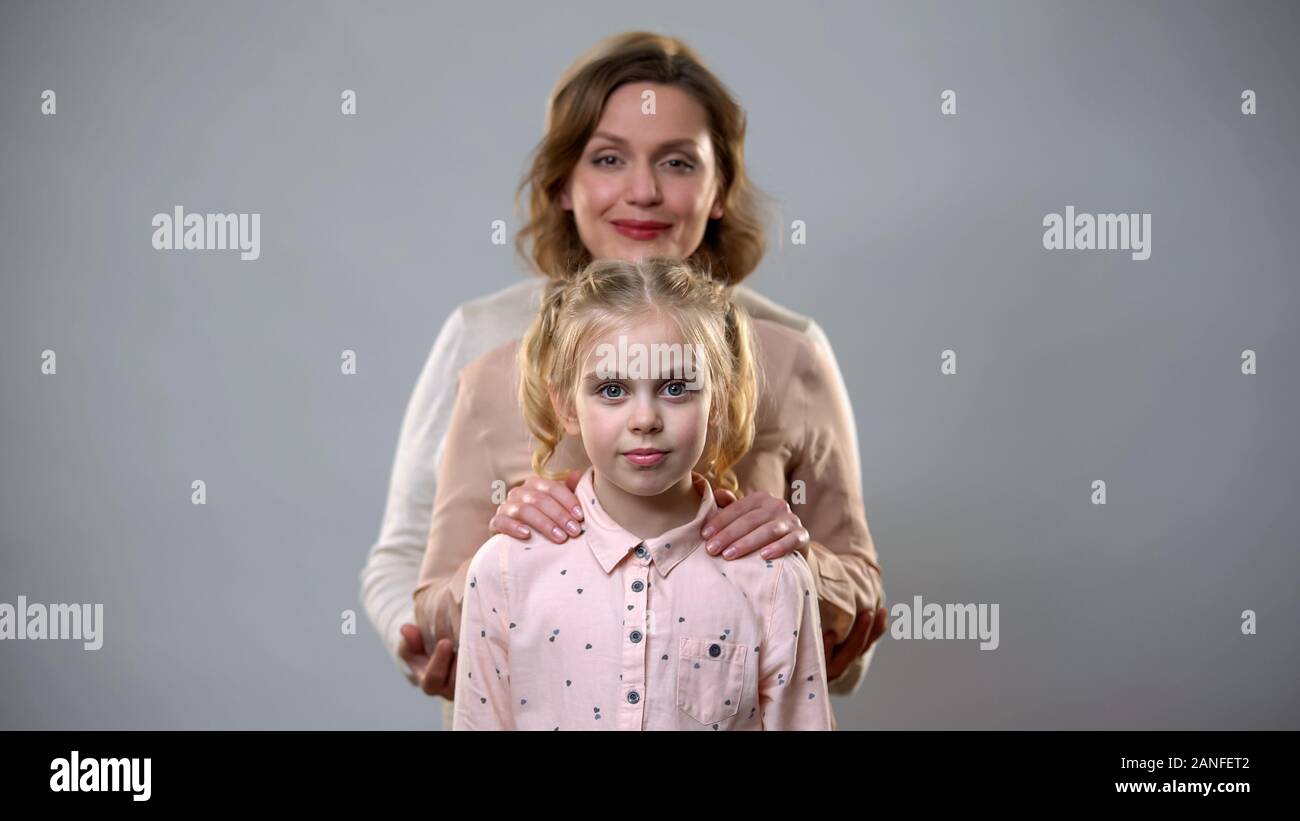 Mother and father hugging girl, female support and care, child ...