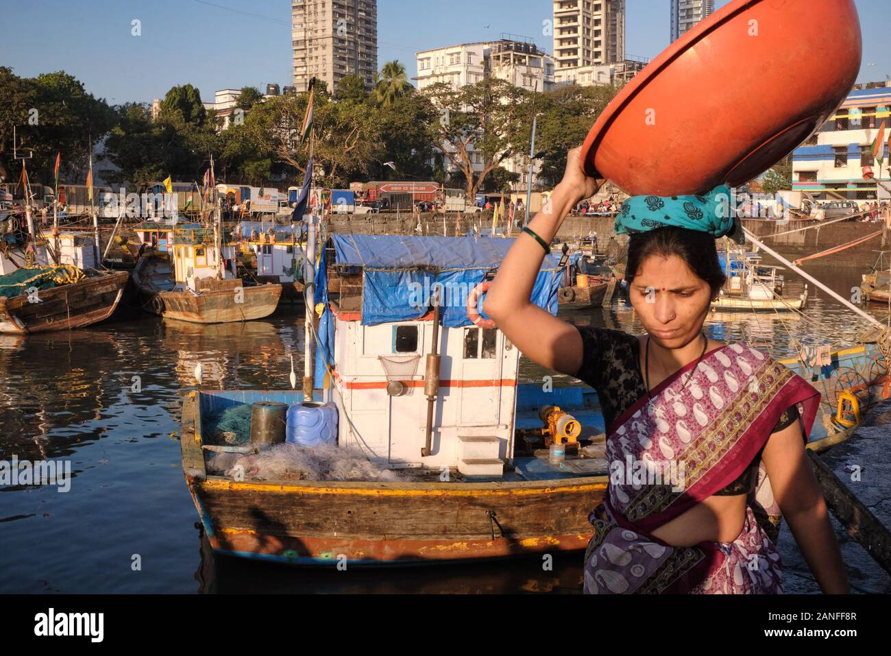 A fish vendor at Sassoon Docks, in Colaba area, Mumbai, India, out to ...