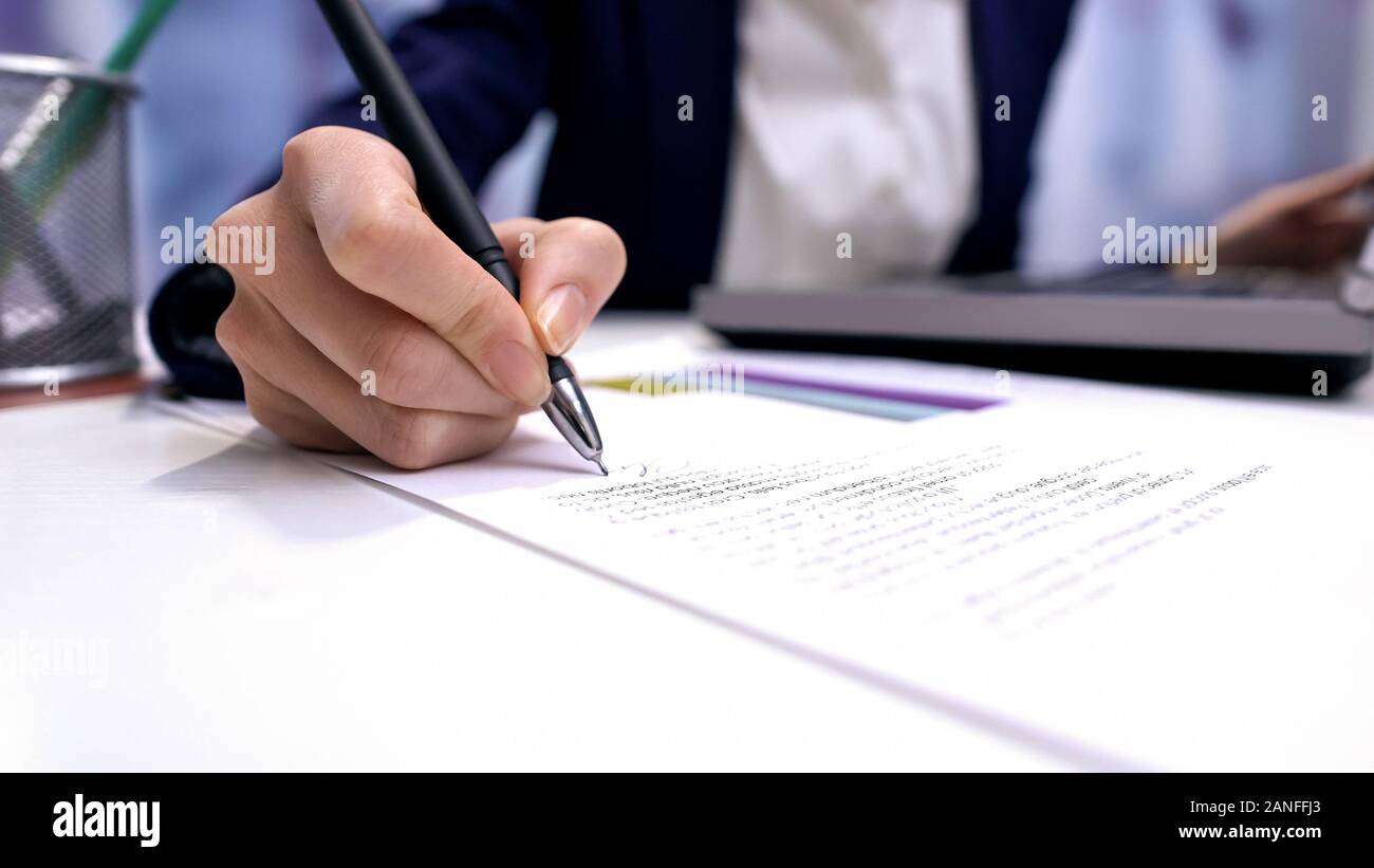 Female director signing document on office table, company agreement ...