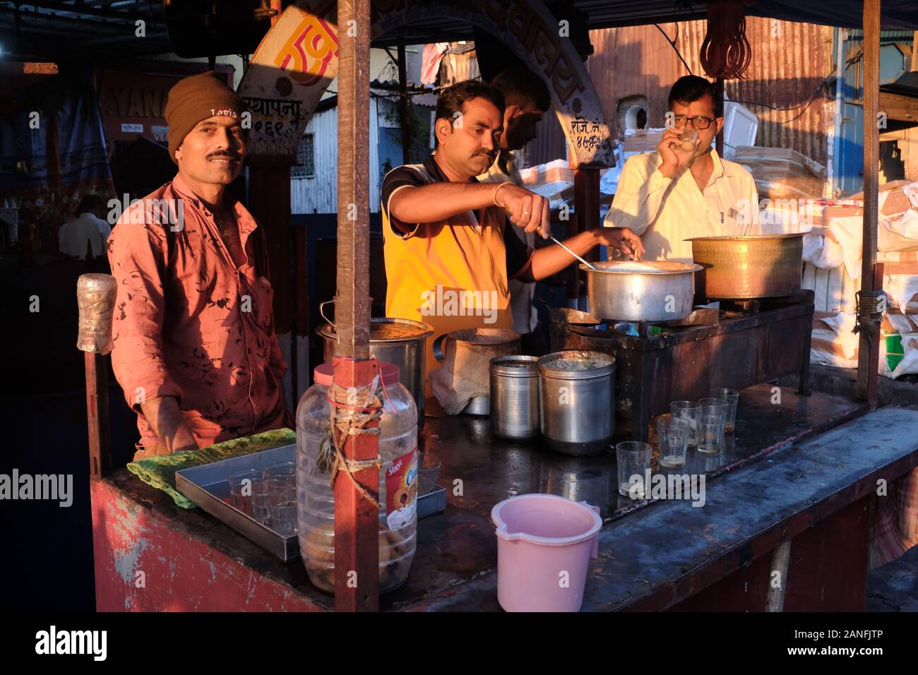 Early morning light illuminates a tea stall near Sassoon Docks in ...