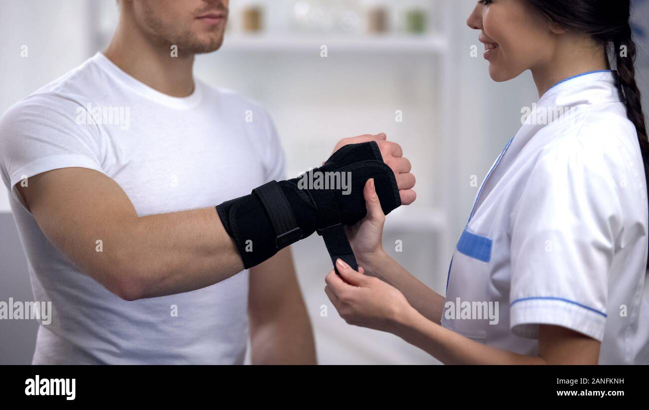 Female surgeon applying titan wrist hi-res stock photography and images ...