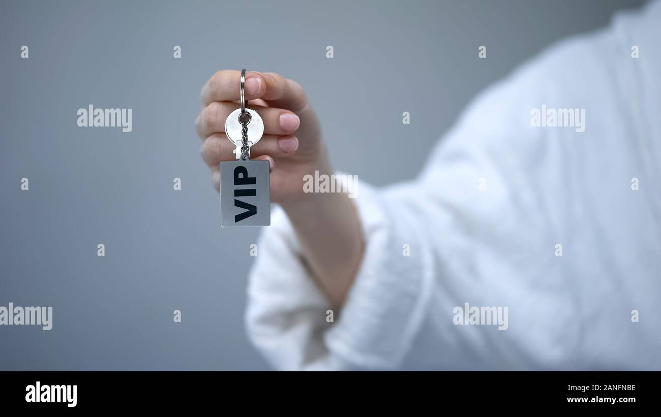 VIP inscription on keychain in person hand, luxury resort for rich ...