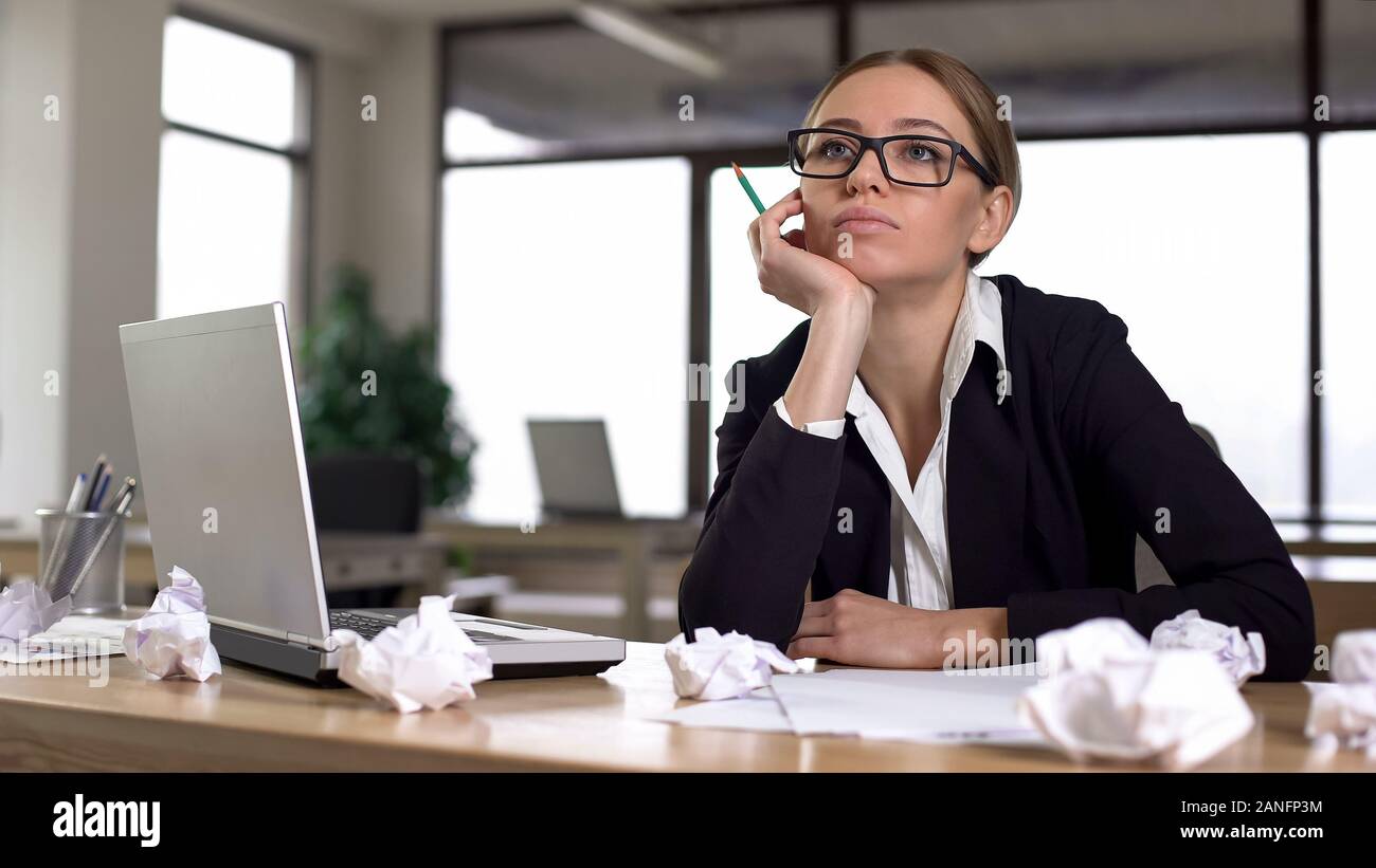 Bored woman thinking over startup in office, lacking new ideas ...