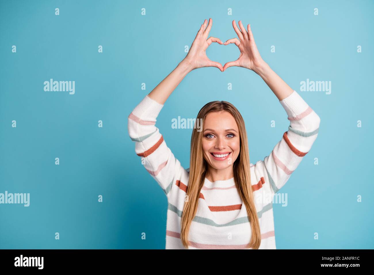 Photo of cheerful positive pretty nice gorgeous woman showing heart ...