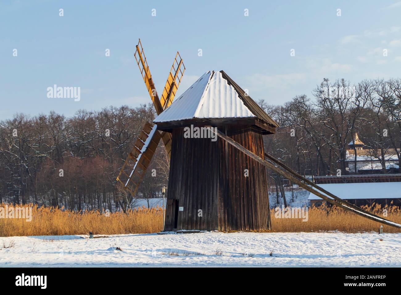 Traditional wooden windmill from Romania in winter landscape Stock ...