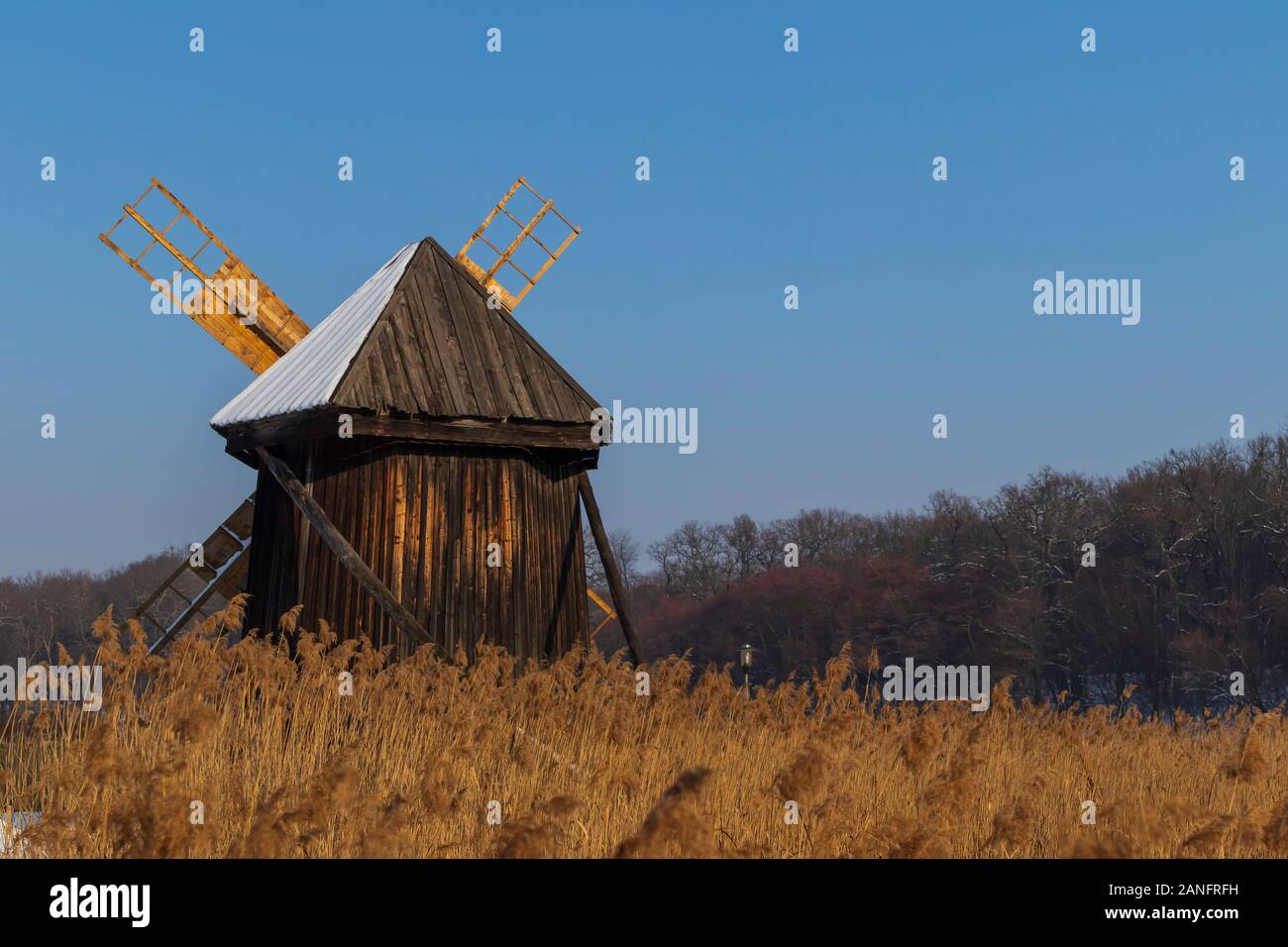 Traditional wooden windmill from Romania in winter landscape Stock ...