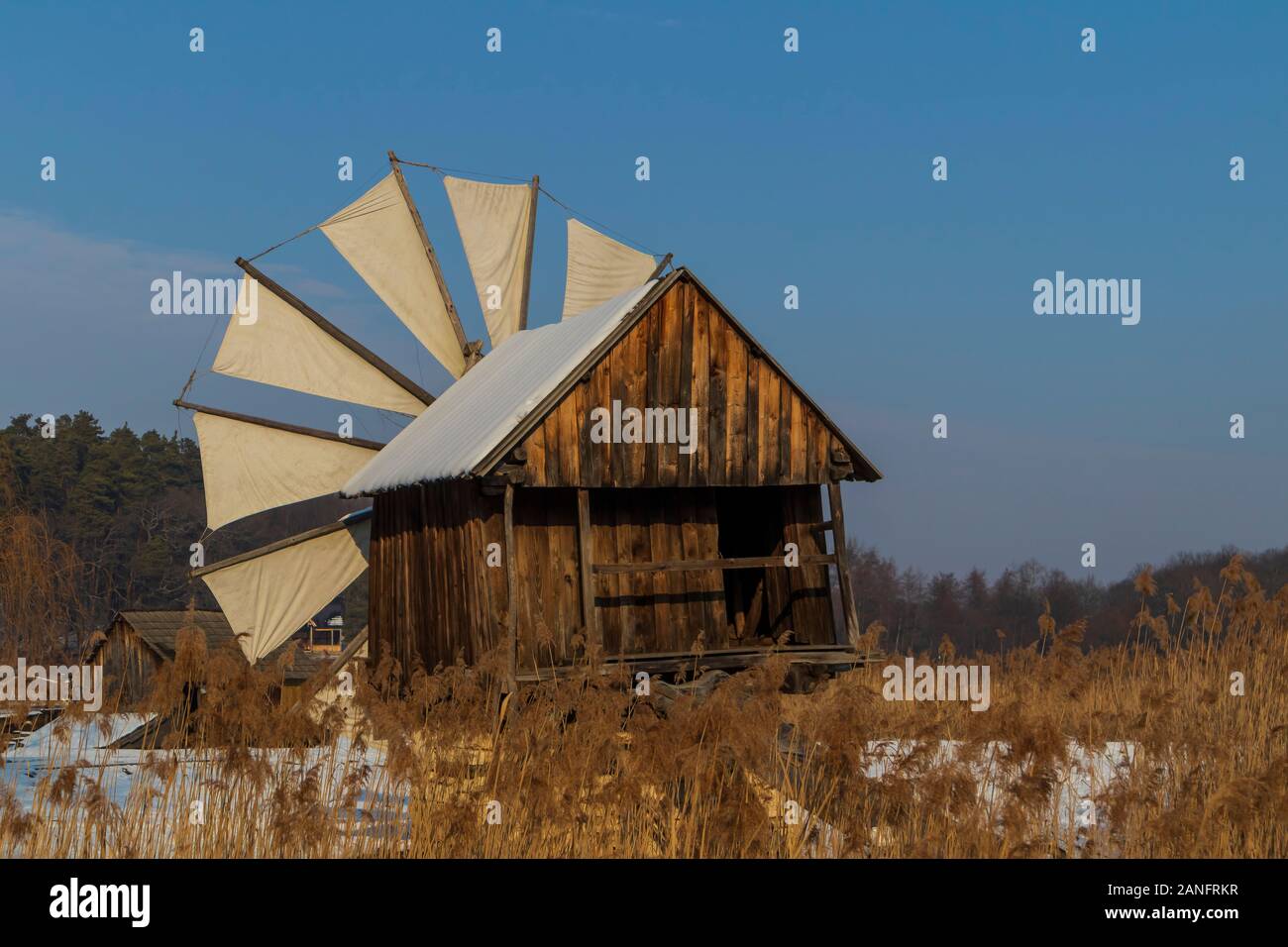 Traditional wooden windmill from Romania in winter landscape Stock ...