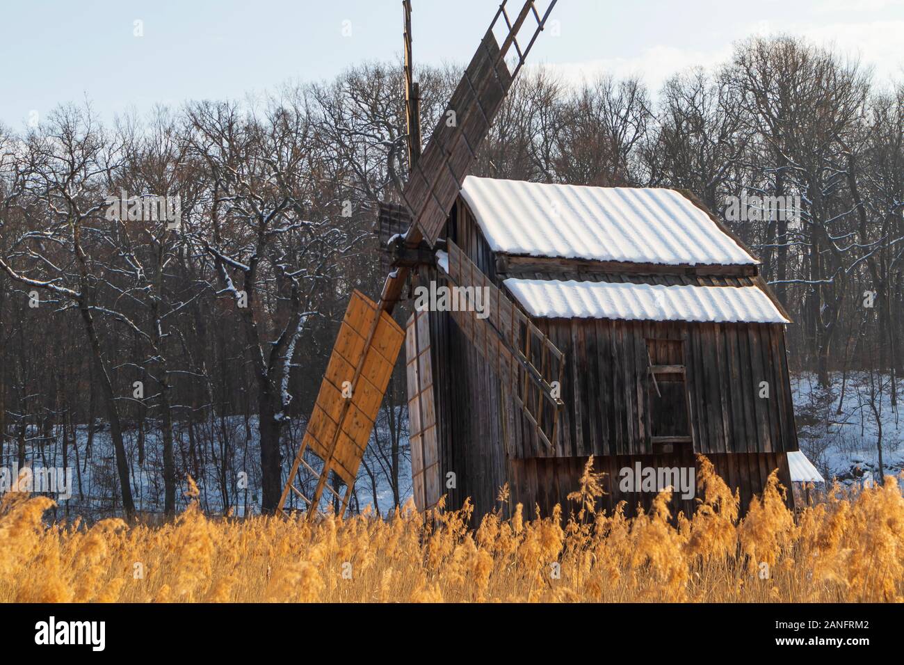 Traditional wooden windmill from Romania in winter landscape Stock ...