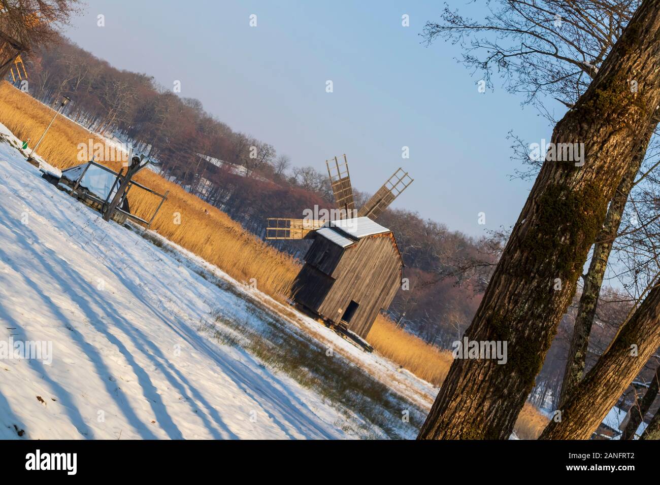 Traditional wooden windmill from Romania in winter landscape Stock ...