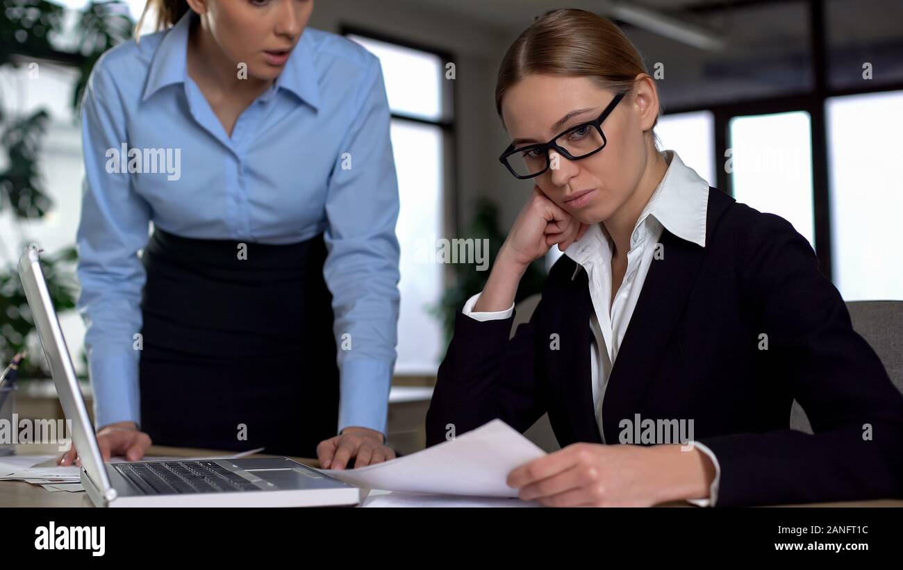 Negative boss scolding young employee for poor work, dissatisfied with ...