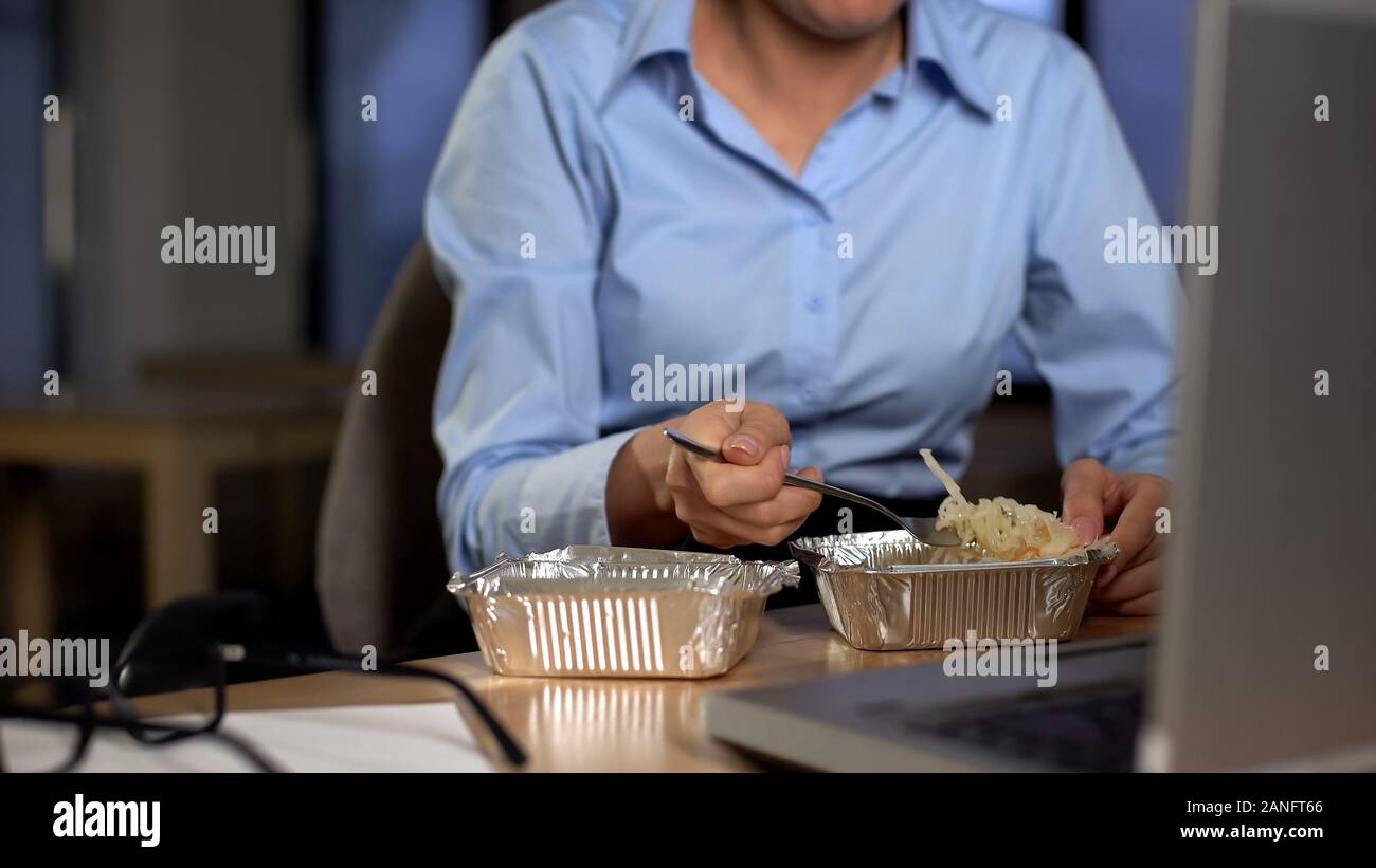 Fat office worker eating hi-res stock photography and images - Alamy